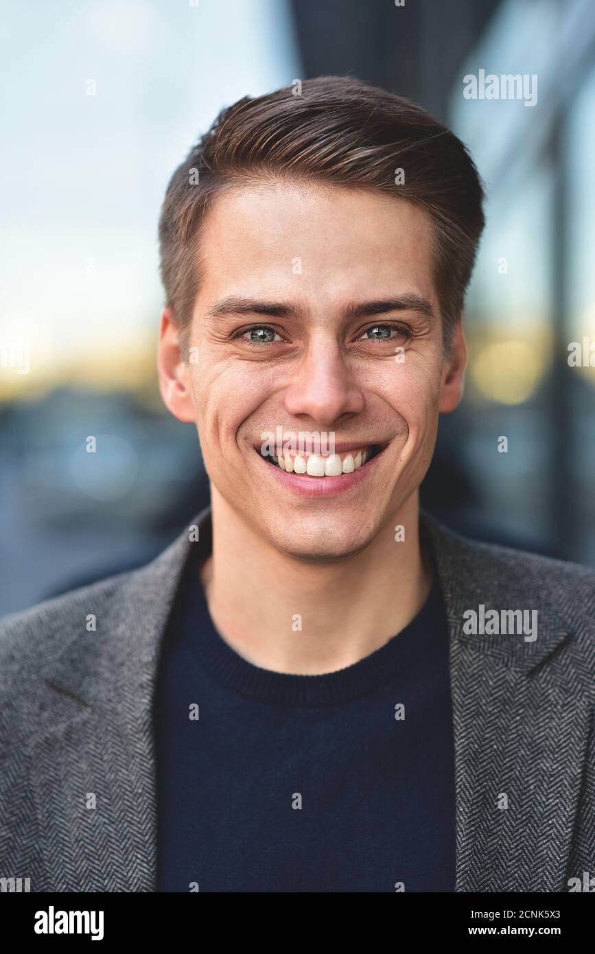 Happy man standing outdoors hi-res stock photography and images - Alamy