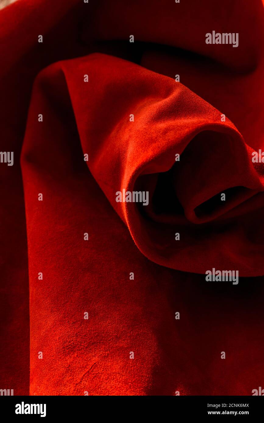 Dark red matte background of suede fabric, closeup. Velvet texture of ...