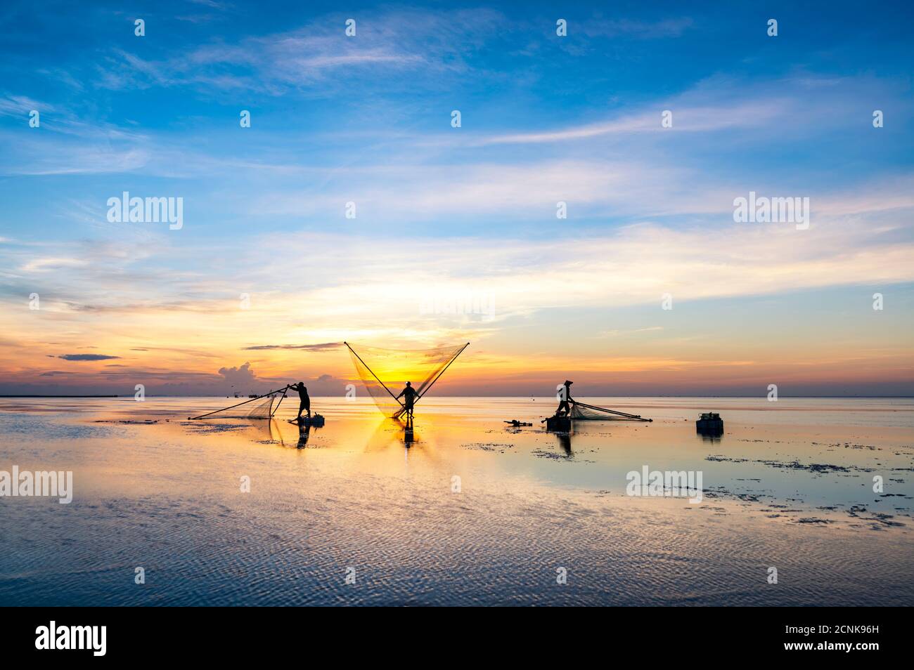 Shadow fishermen in the early morning Stock Photo - Alamy