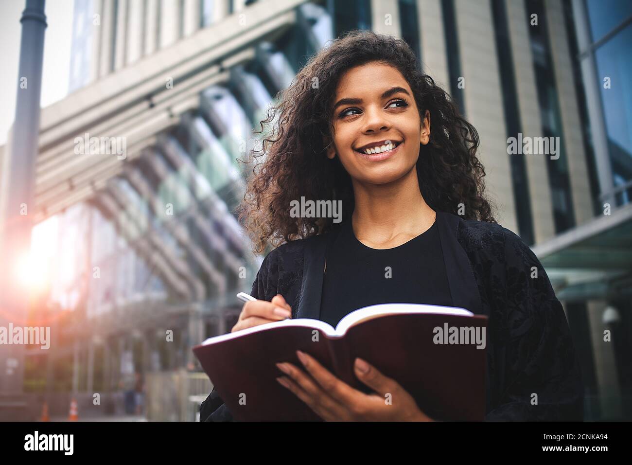 Black lady writing hi-res stock photography and images - Alamy