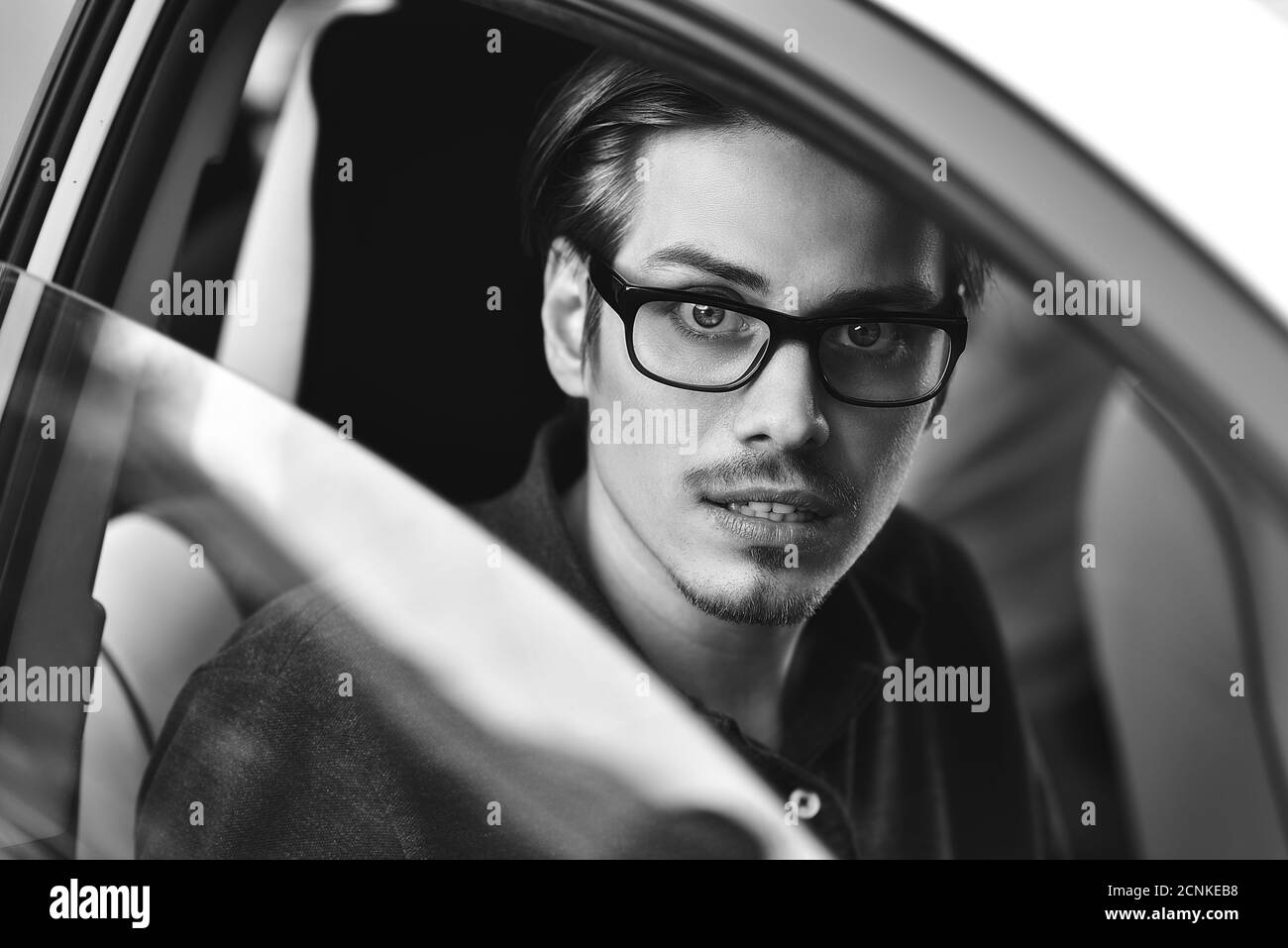Close up side portrait of caucasian man driving car Stock Photo - Alamy