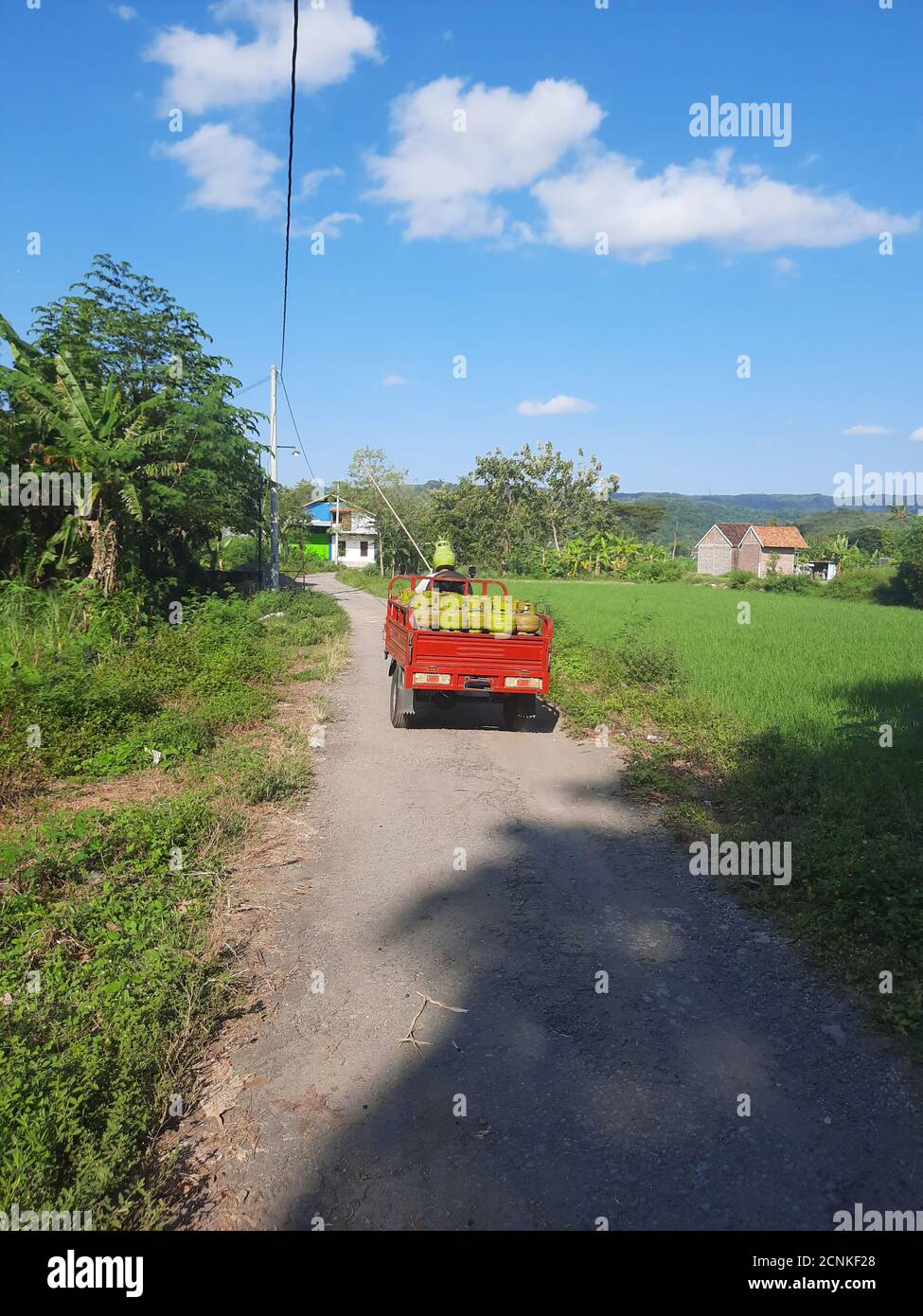 Vertical shot of a gas seller with a cart full of gas Stock Photo - Alamy