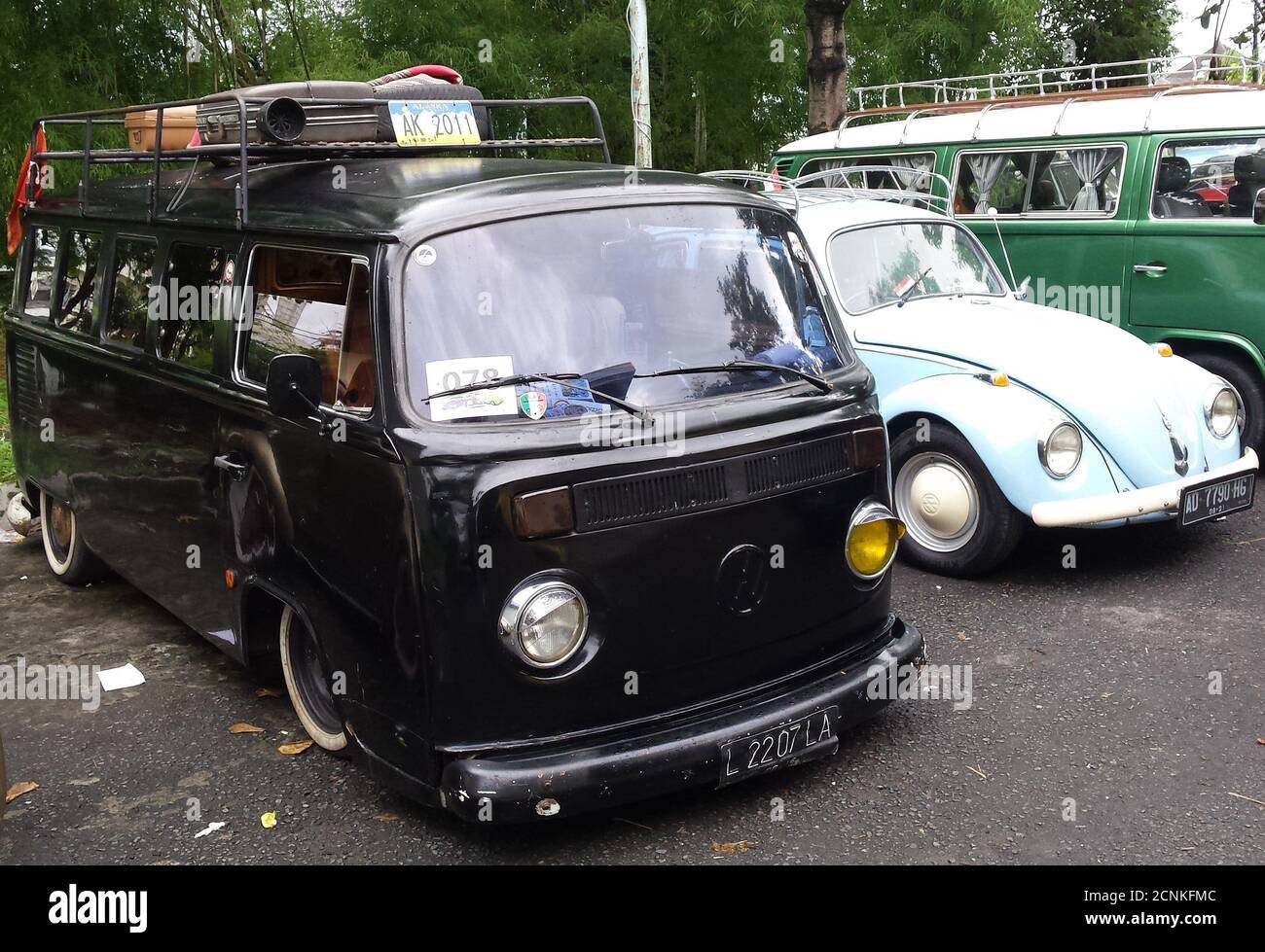 Full length front view from one black VW Bulli, VW Combi in a parking ...