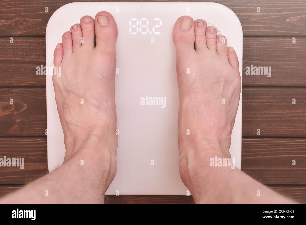 Man skinny scales hi-res stock photography and images - Alamy