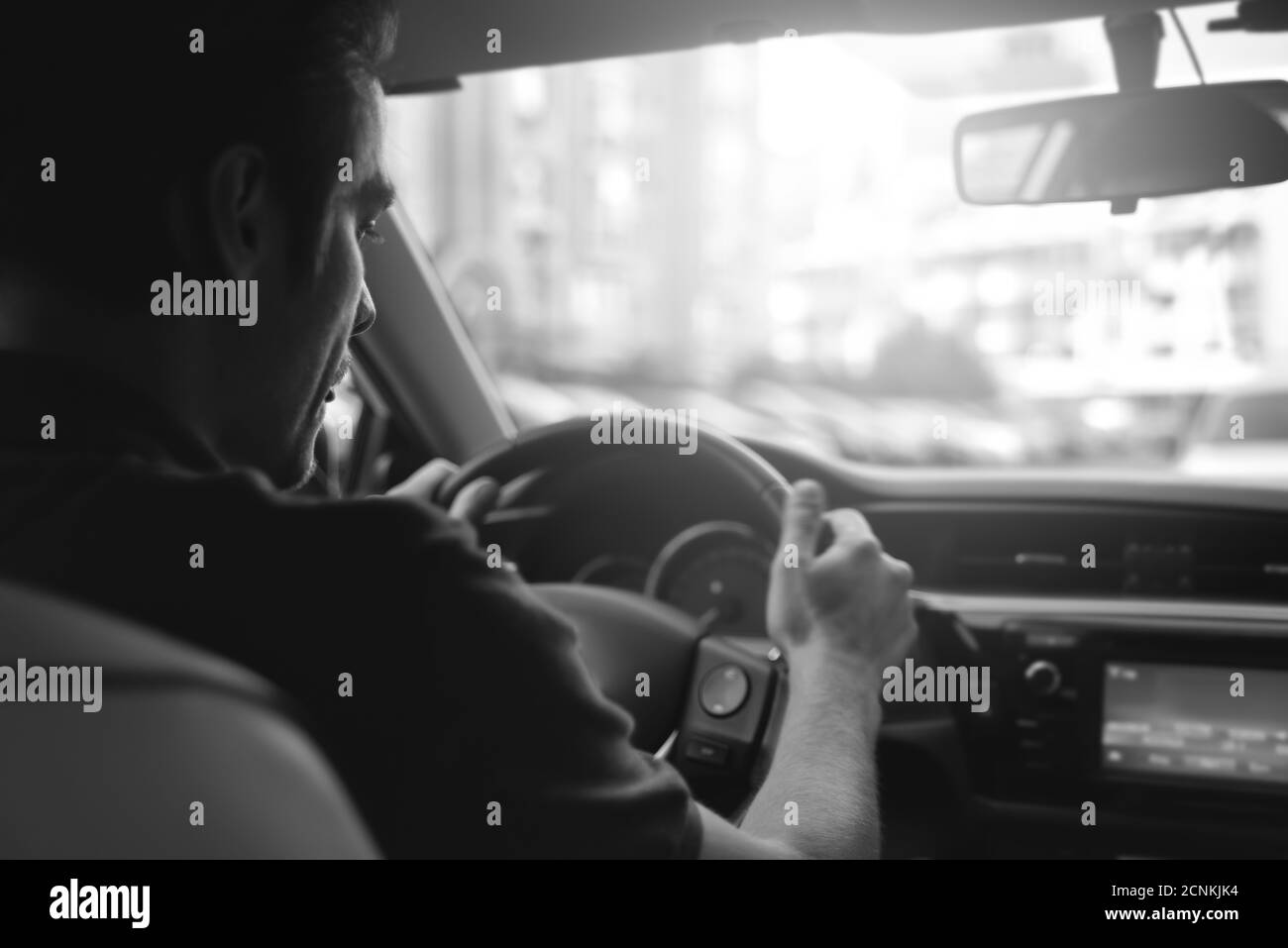 Portrait of an handsome guy driving his car Stock Photo - Alamy