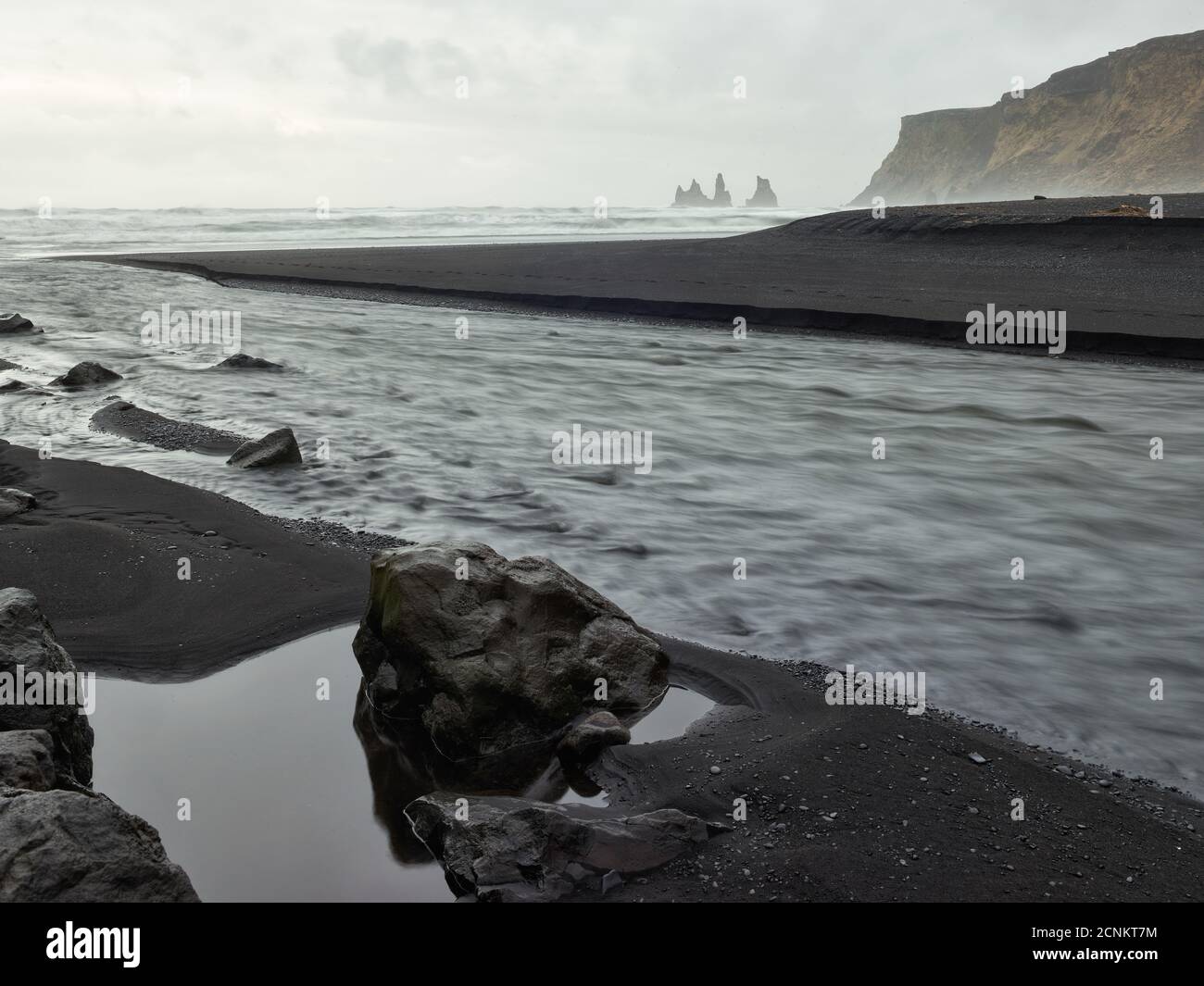 Beach, black sand, river, stream, waves, surf, rocks, needle Stock ...