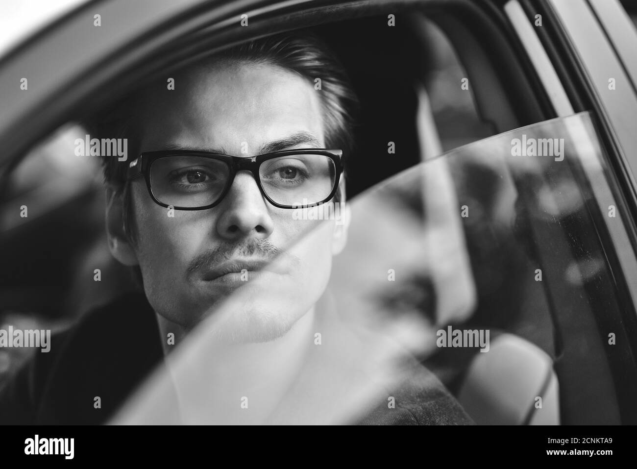 Man driving car side view Black and White Stock Photos & Images - Alamy