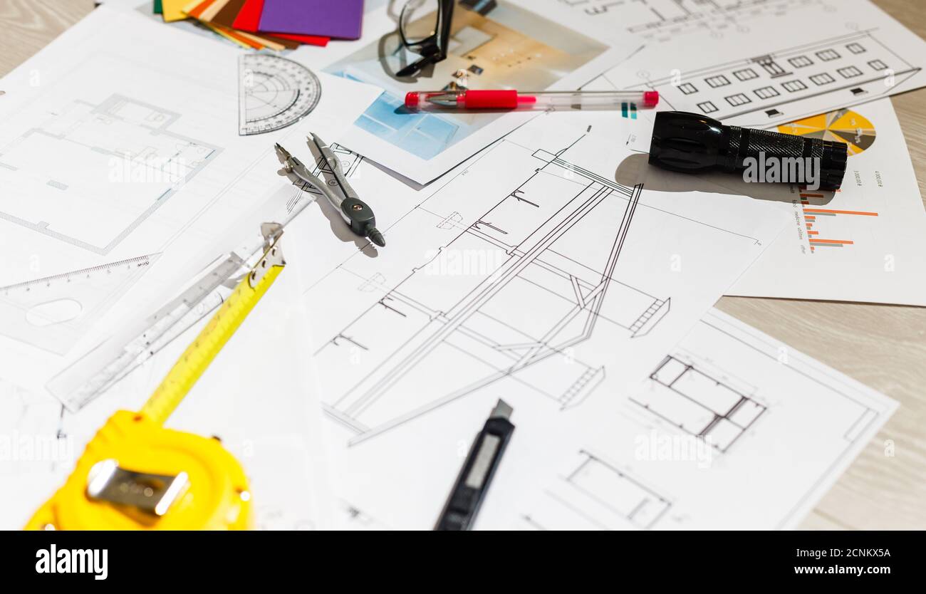 Tools and papers with sketches on the table Stock Photo - Alamy