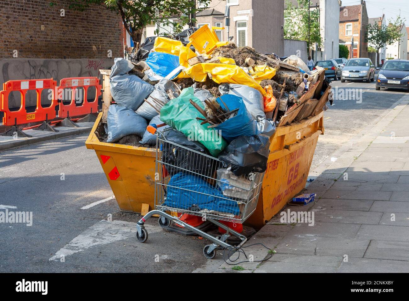 Overflowing skip hi-res stock photography and images - Alamy