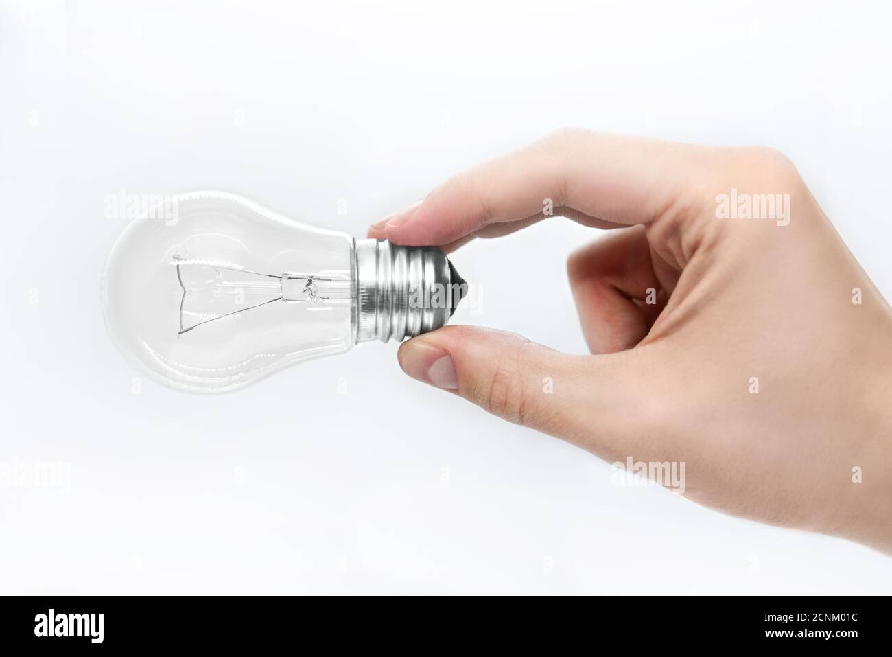Hand holds light bulb hi-res stock photography and images - Alamy