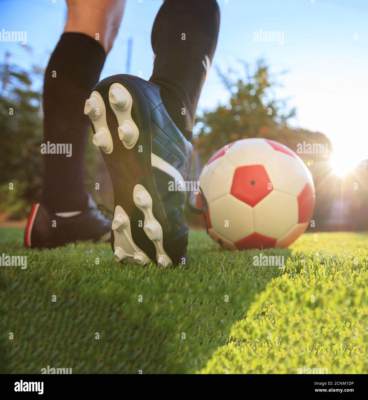 Football kick grass hi-res stock photography and images - Alamy