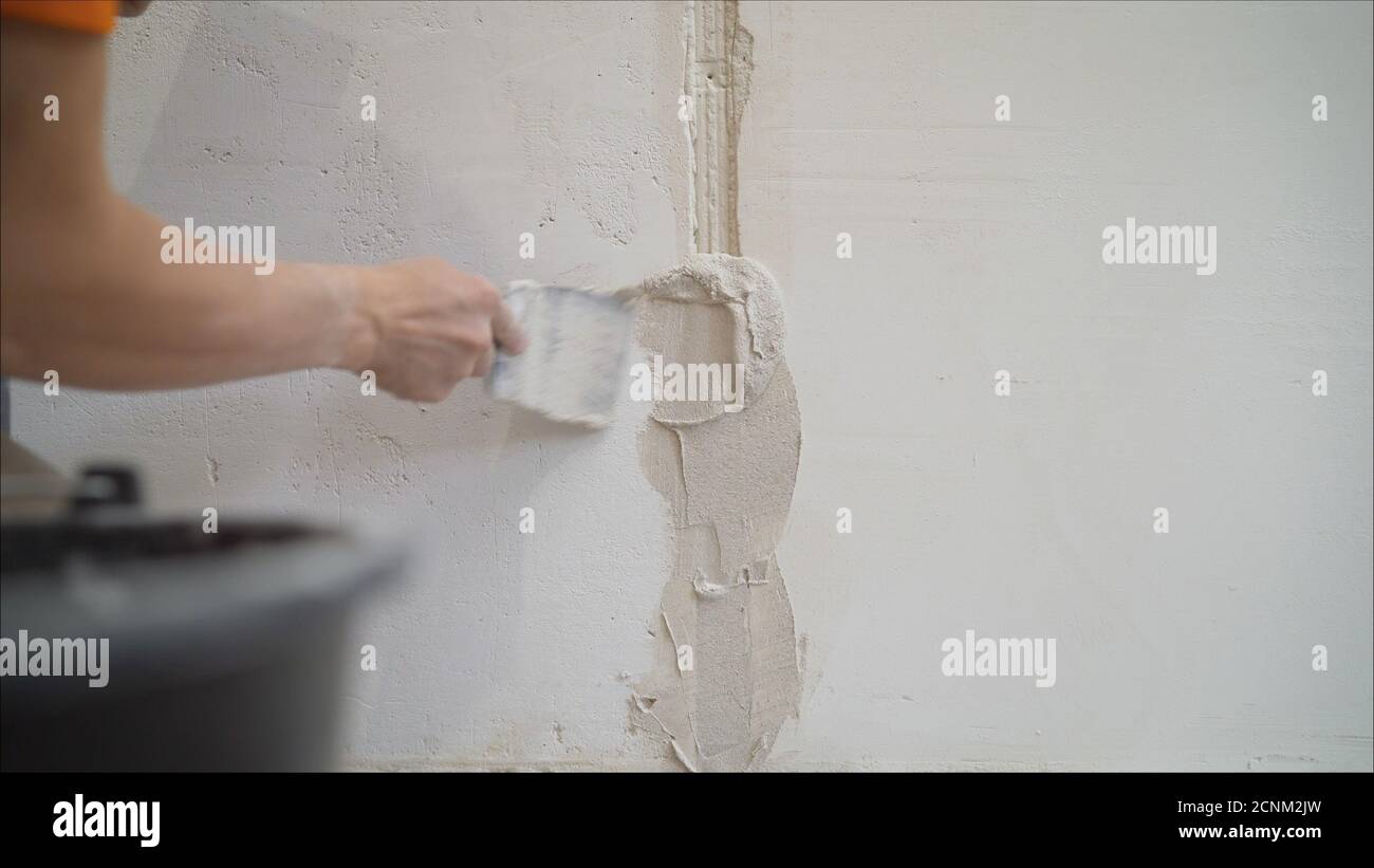 Hands plasterer work application hi-res stock photography and images ...