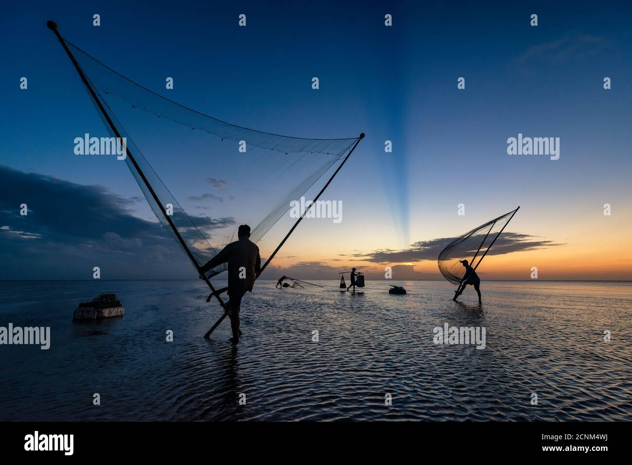 Shadow fishermen in the early morning Stock Photo - Alamy