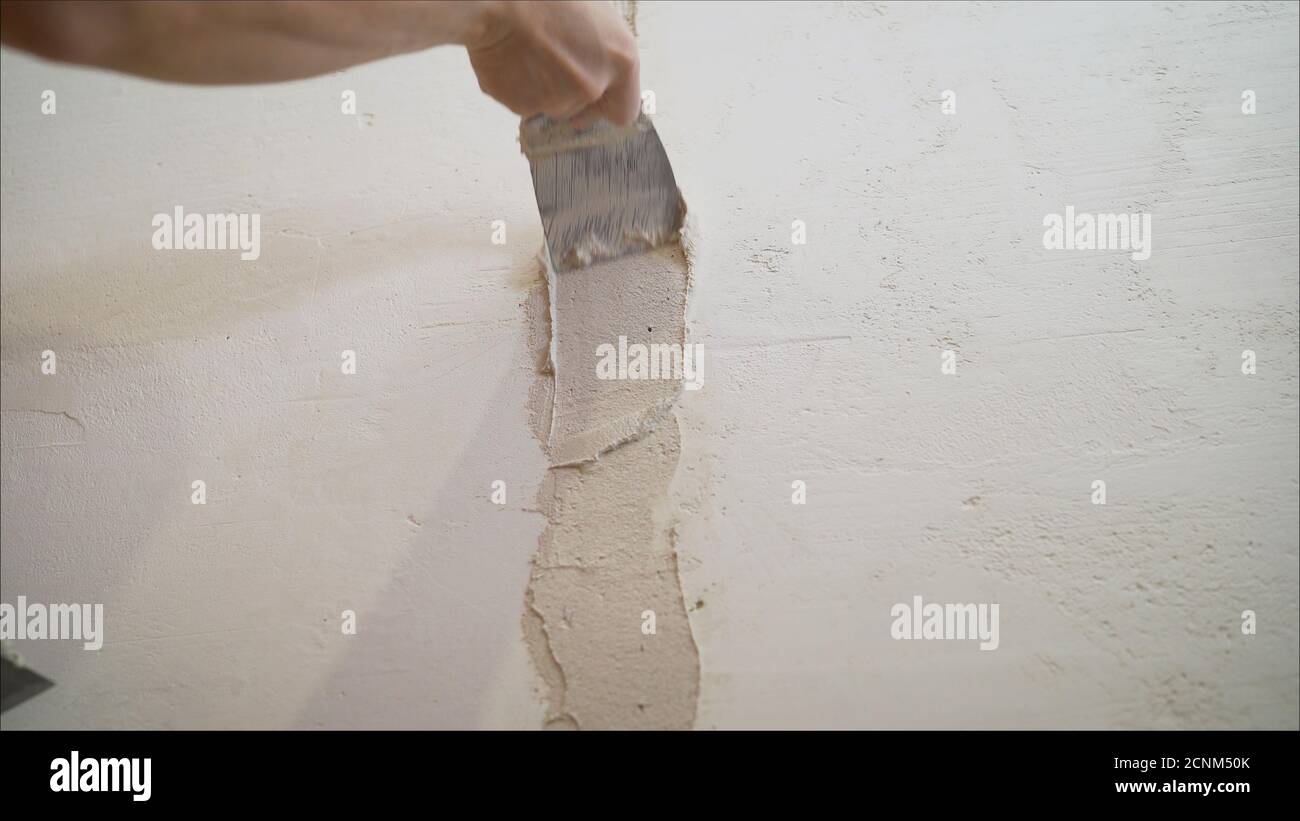 Plastering the wall. Hands Plasterer at work. Application of the ...