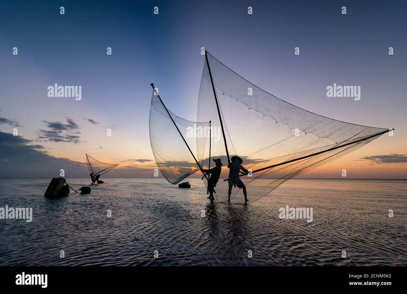 Shadow fishermen in the early morning Stock Photo - Alamy