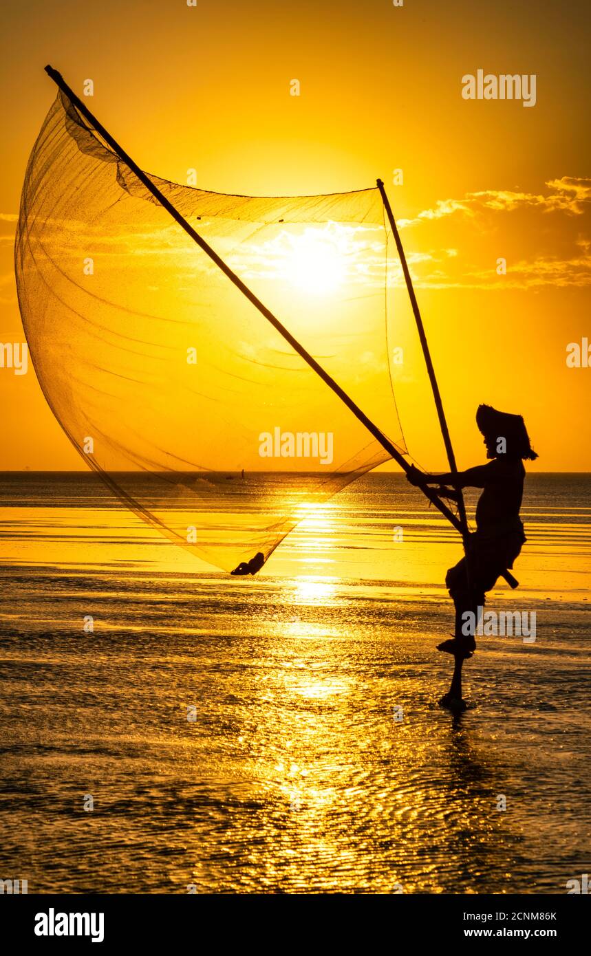 Shadow fishermen in the early morning Stock Photo - Alamy