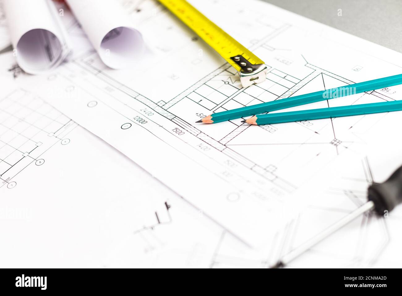 Architectural project, blueprints, blueprint rolls, ruler and pencil ... Architectural project, blueprints, blueprint rolls, ruler and pencil ...
