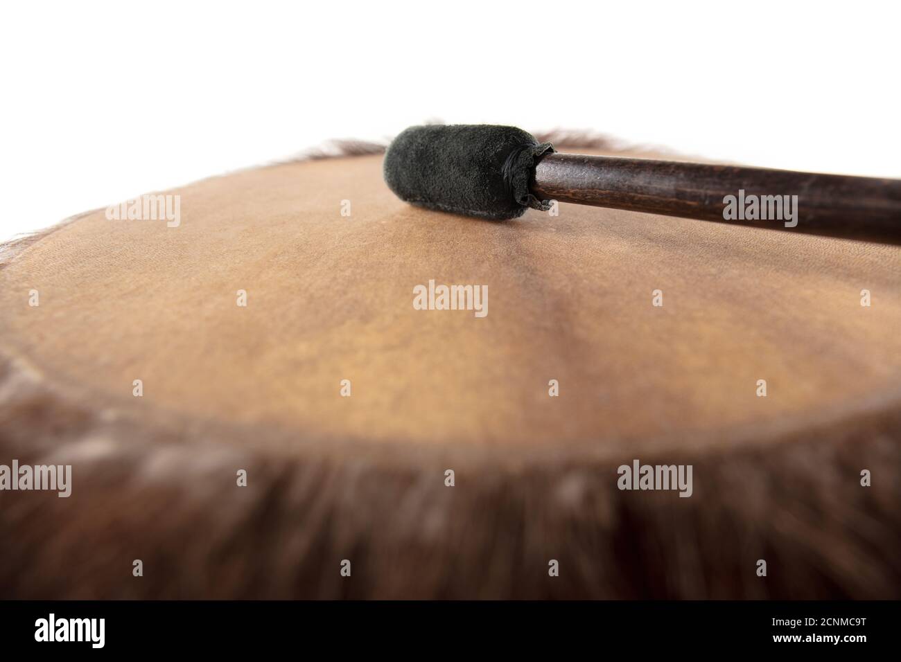 A close up of hands playing the tambourine, percussion on white studio ...
