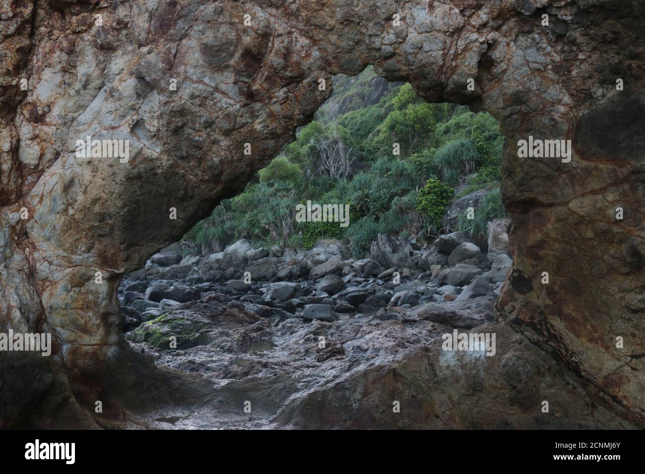 Frame view through a hole in a rock at a coast Stock Photo - Alamy