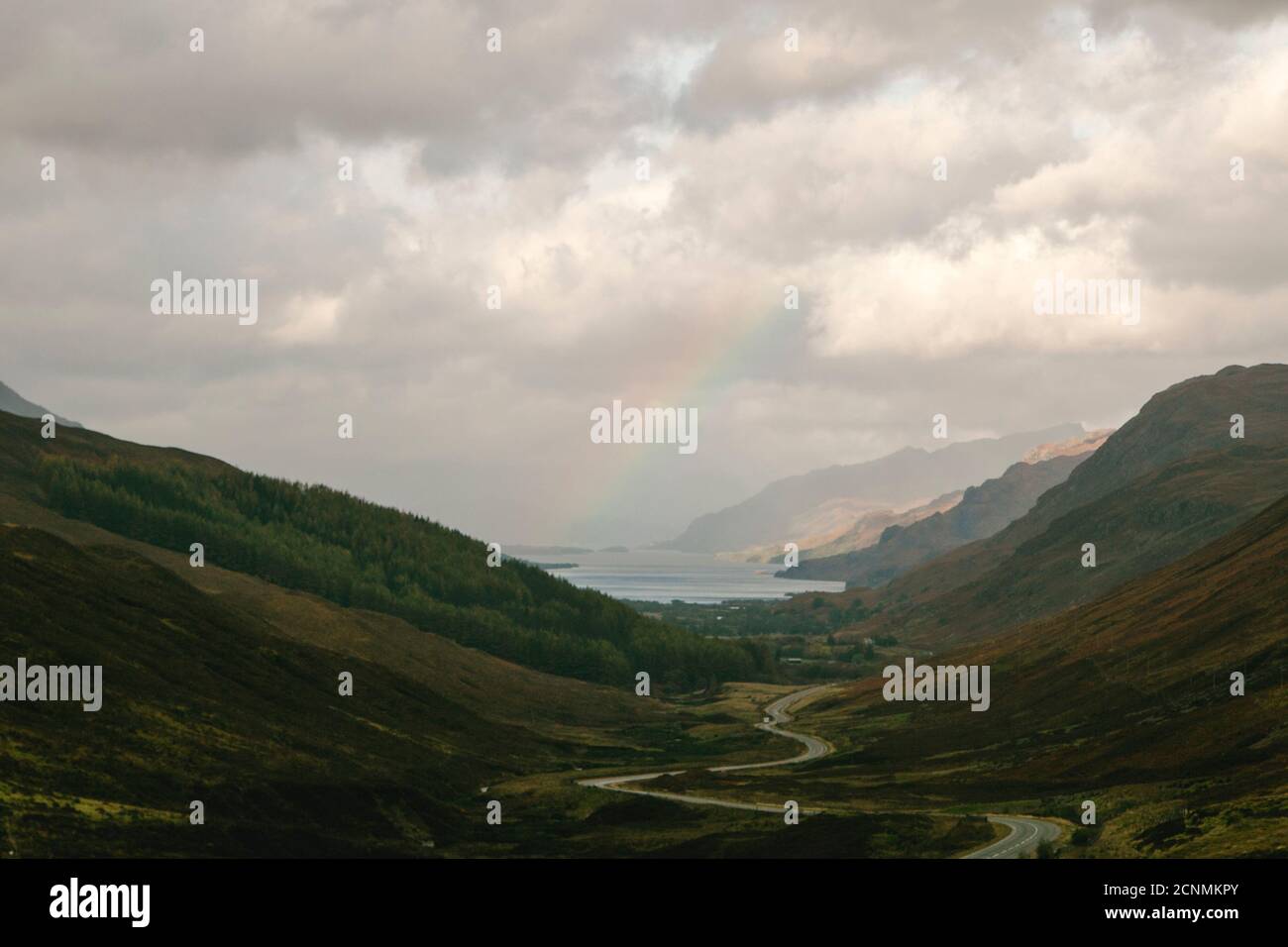 Landscape in Scotland's highlands rainbow over valley Stock Photo - Alamy