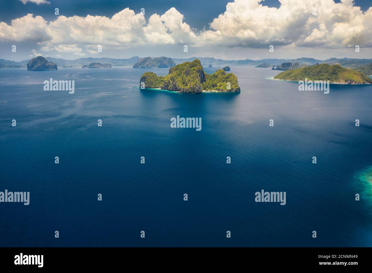 Aerial view the Entalula Island from the distance. Open ocean, white ...