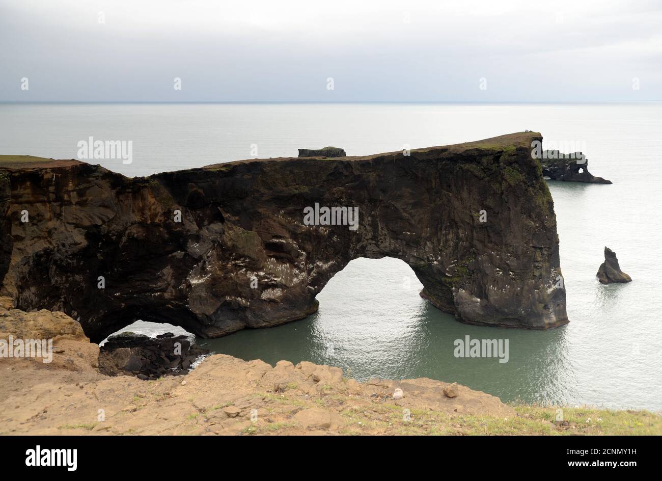 Rock arch at Dyrholaey, Iceland Stock Photo - Alamy