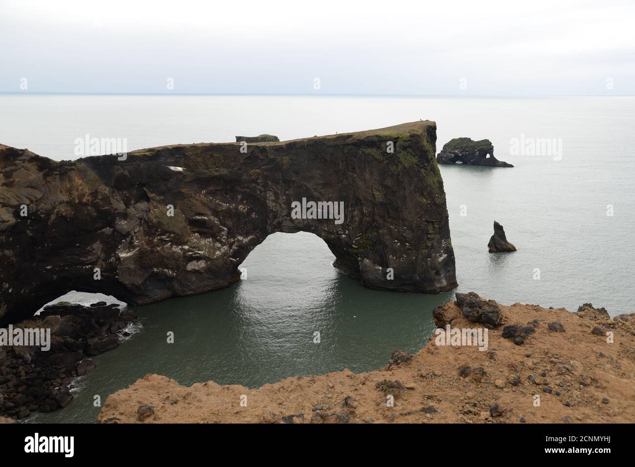 Rock arch at Dyrholaey, Iceland Stock Photo - Alamy