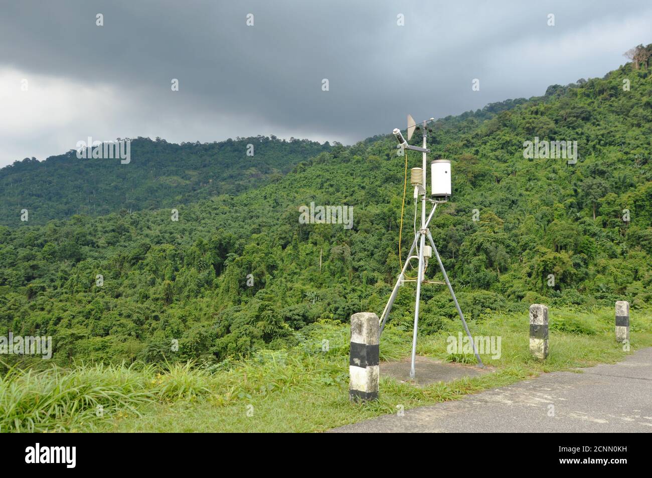 Pluviometer or rain gauge in mountain background with rain cloud on sky ...