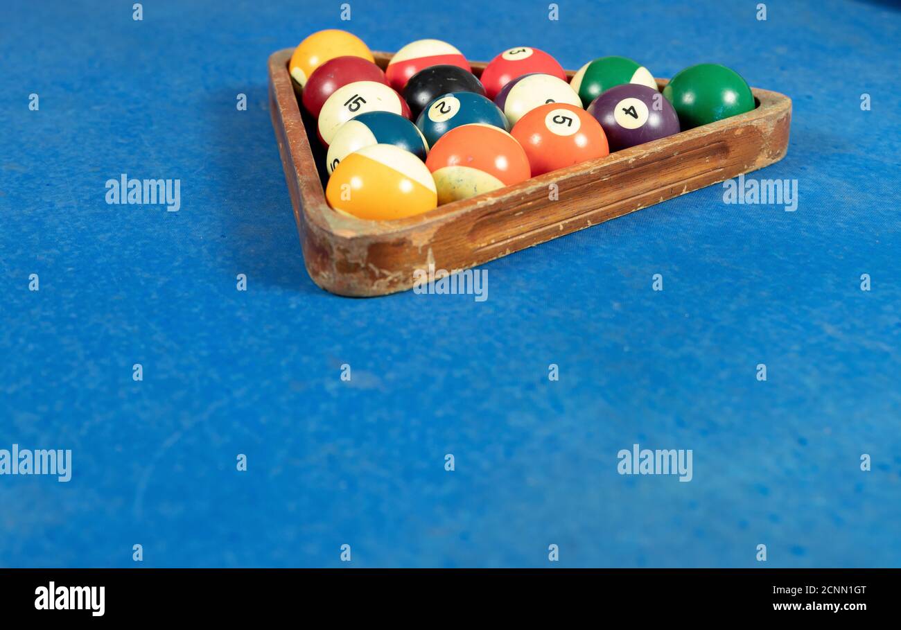 Selective focus shot of colorful billiard balls on pool blue table ...