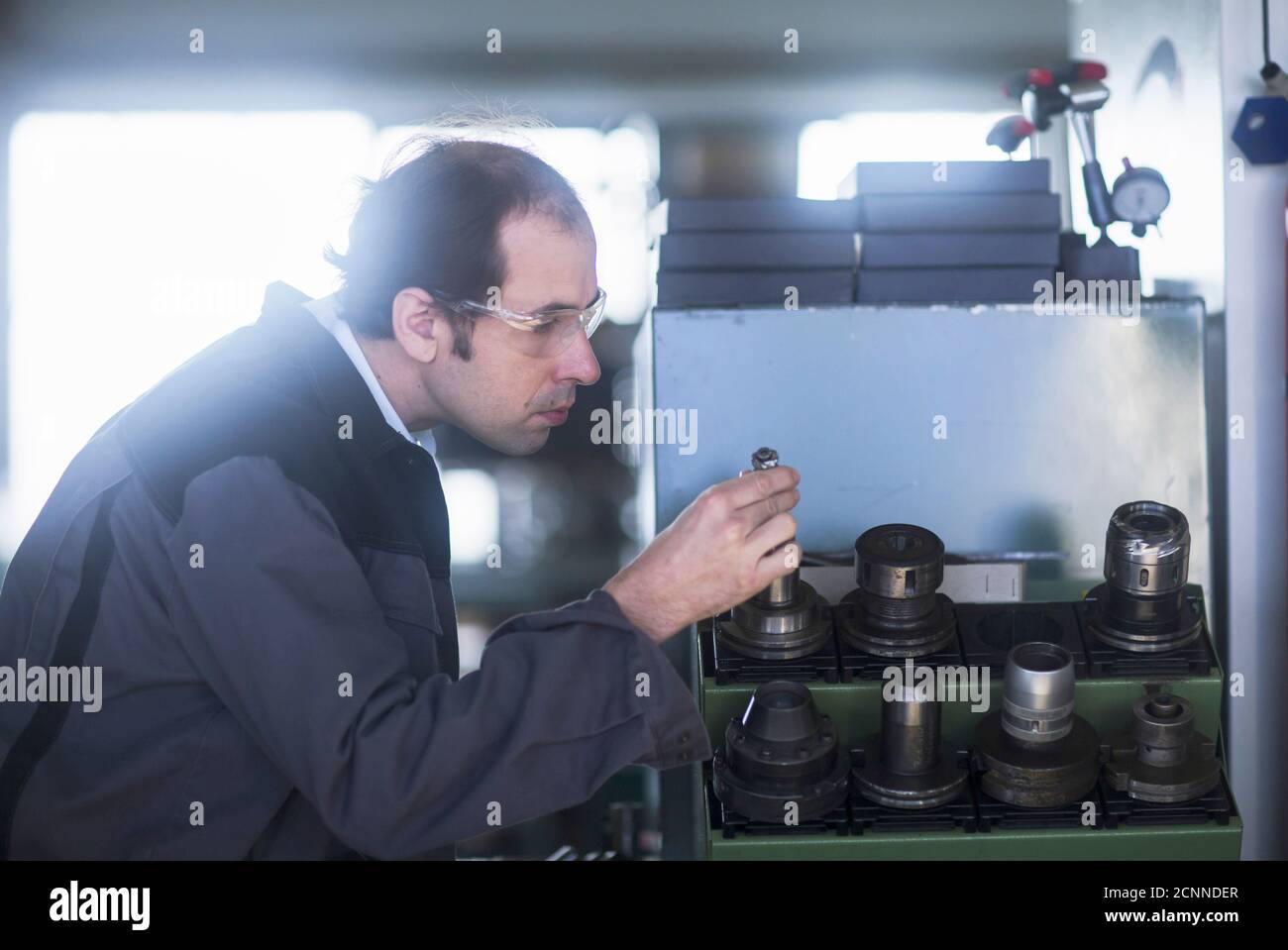 Engineer checking equipment at an industrial plant, Germany Stock Photo ...