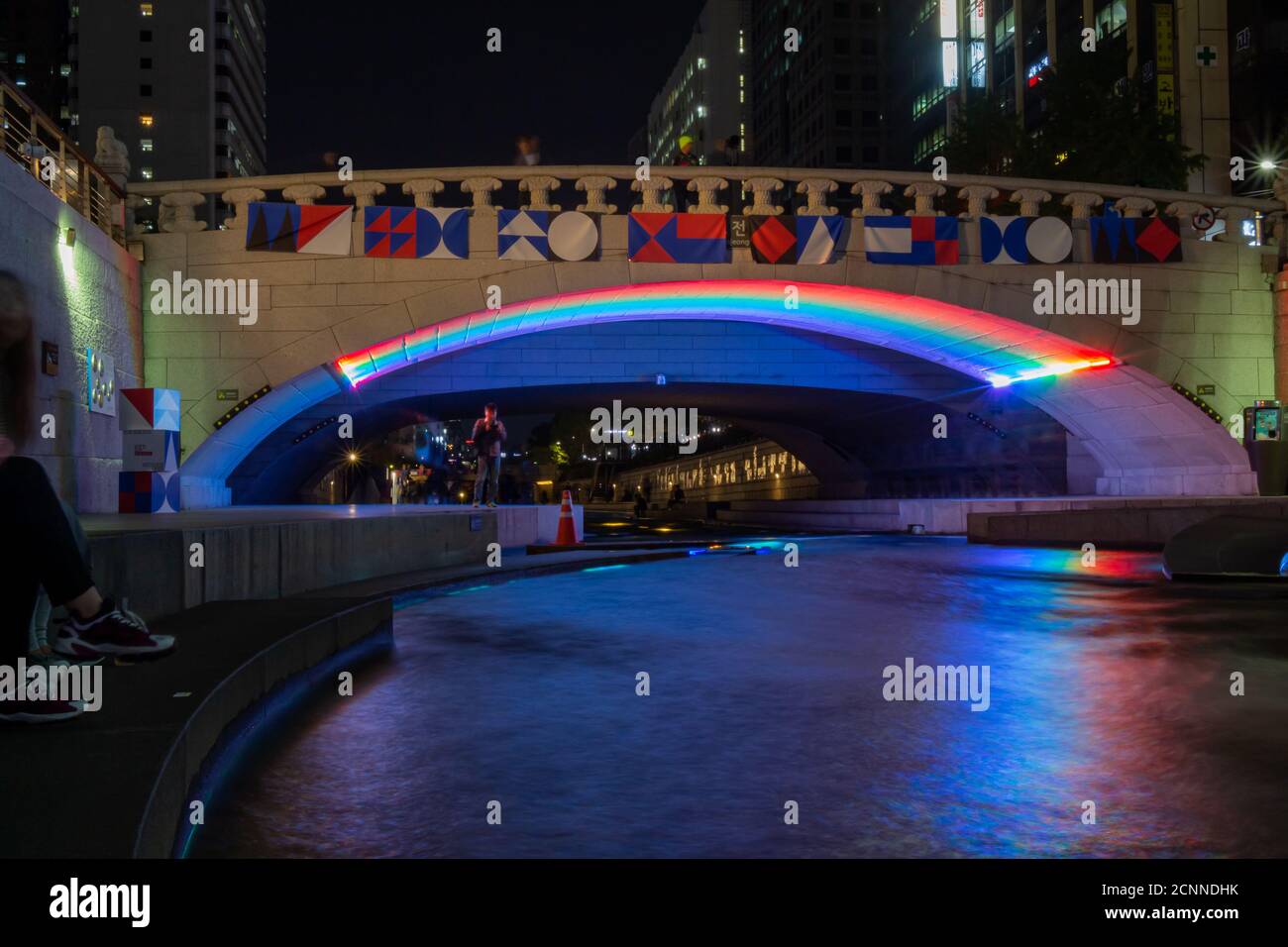 The Cheonggyecheon Stream at Gwangtonggyo Bridge at night, with a ...