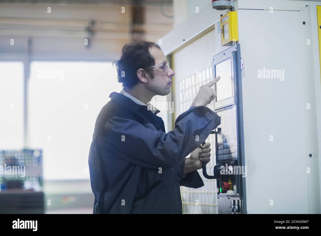 Engineer checking equipment at an industrial plant, Germany Stock Photo ...