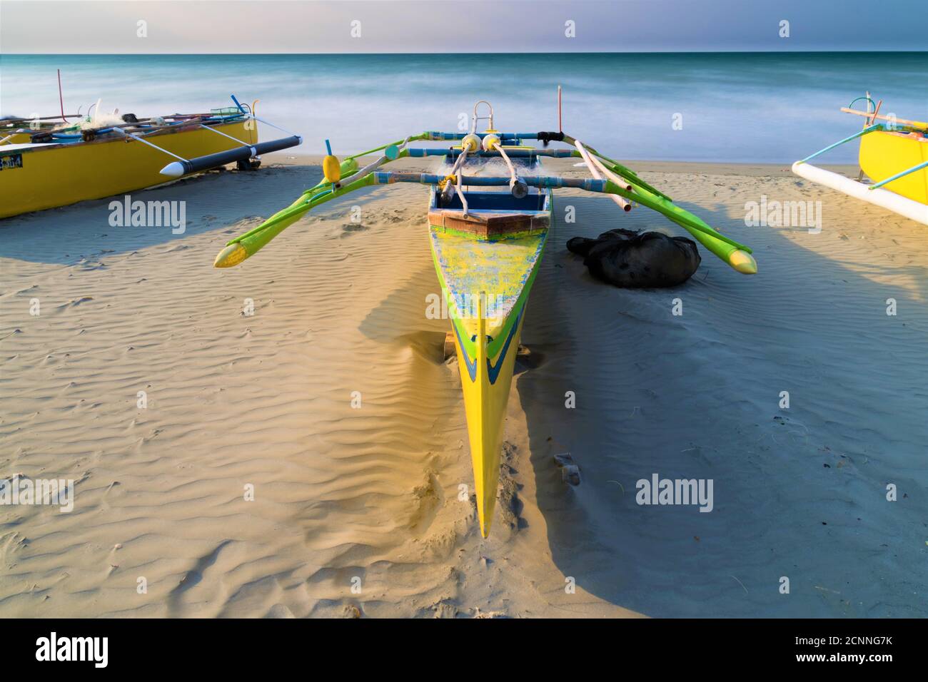 Traditional jukung boats moored on beach, Philippines Stock Photo - Alamy