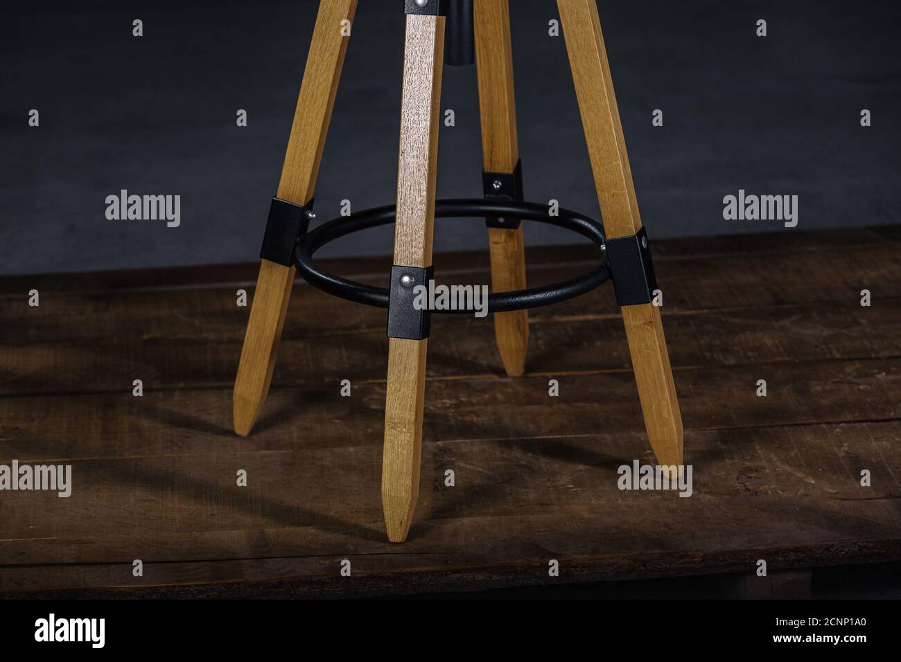 Tall wooden stool in a studio Stock Photo - Alamy