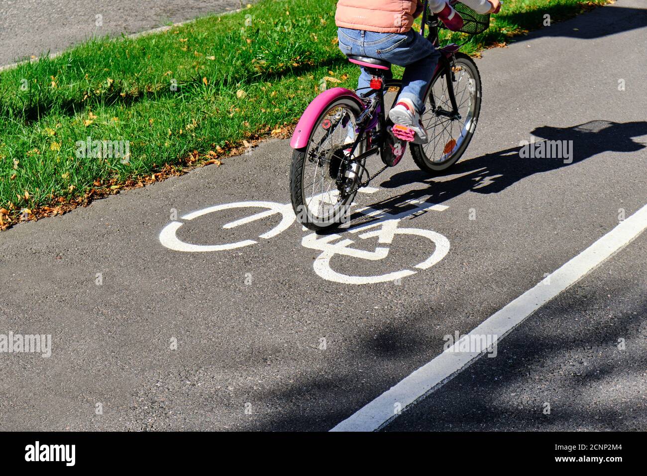 Girl rides pink bicycle hi-res stock photography and images - Alamy