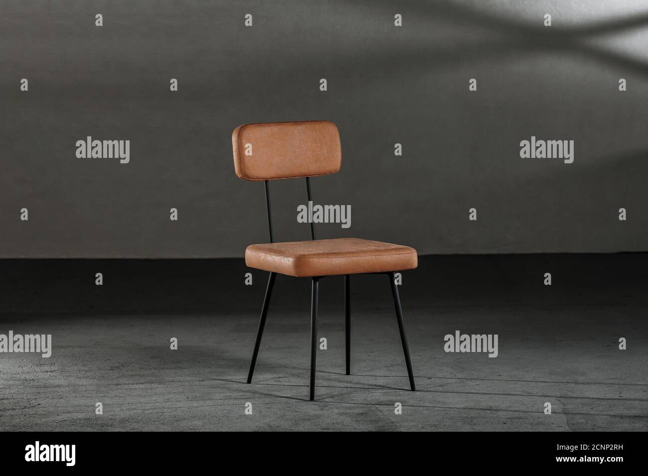 Wooden chair with metal legs in a studio Stock Photo - Alamy