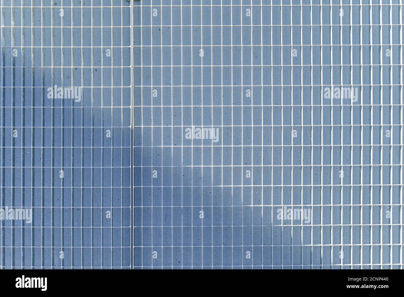 The metal grid on a concrete wall is a building design element Stock ...