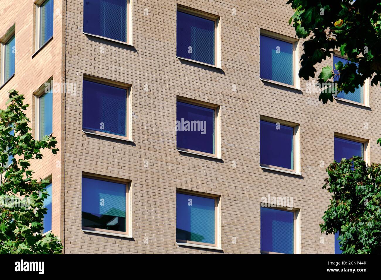The blue windows in the brick wall. Modern Nordic architecture in ...