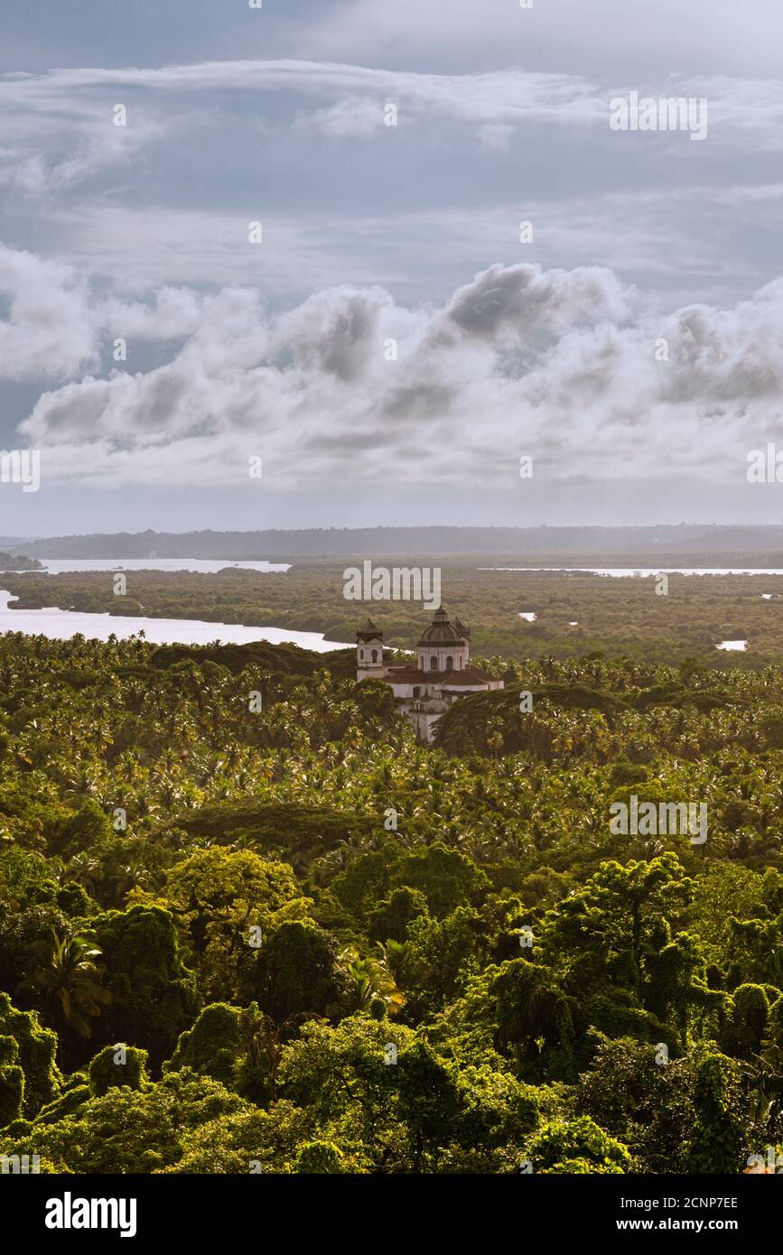Aerial view of a tropical landscape in Goa, India with ancient catholic ...