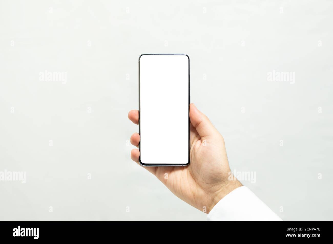 Holding a vertical white screen smartphone with isolated background ...