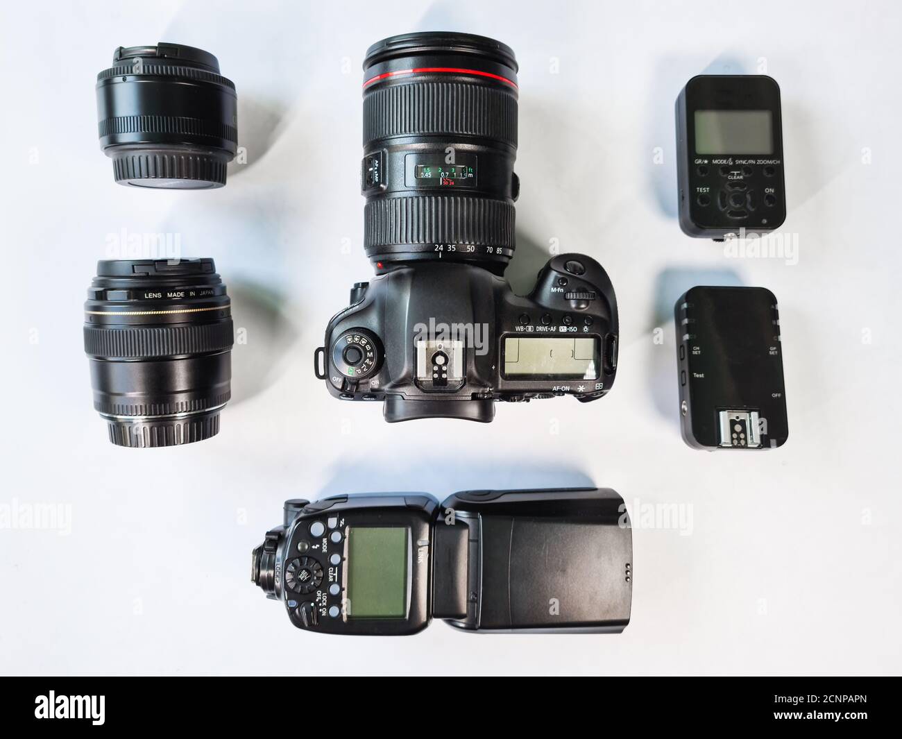Photography gear kit, camera lens flash trigger on the desk top view ...