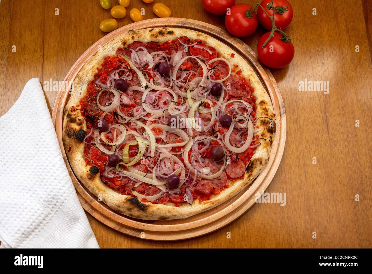 Pizza de Calabresa, Brazilian food. Calabrese sausage pizza with ...