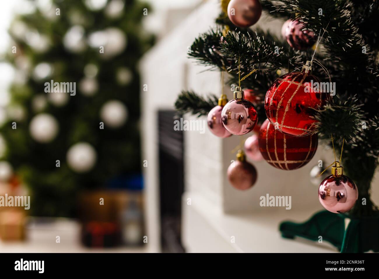 decorated mini christmas tree in the apartment Stock Photo - Alamy