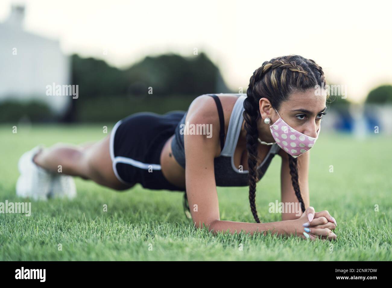 Attractive female wearing a mask while exercising Stock Photo - Alamy