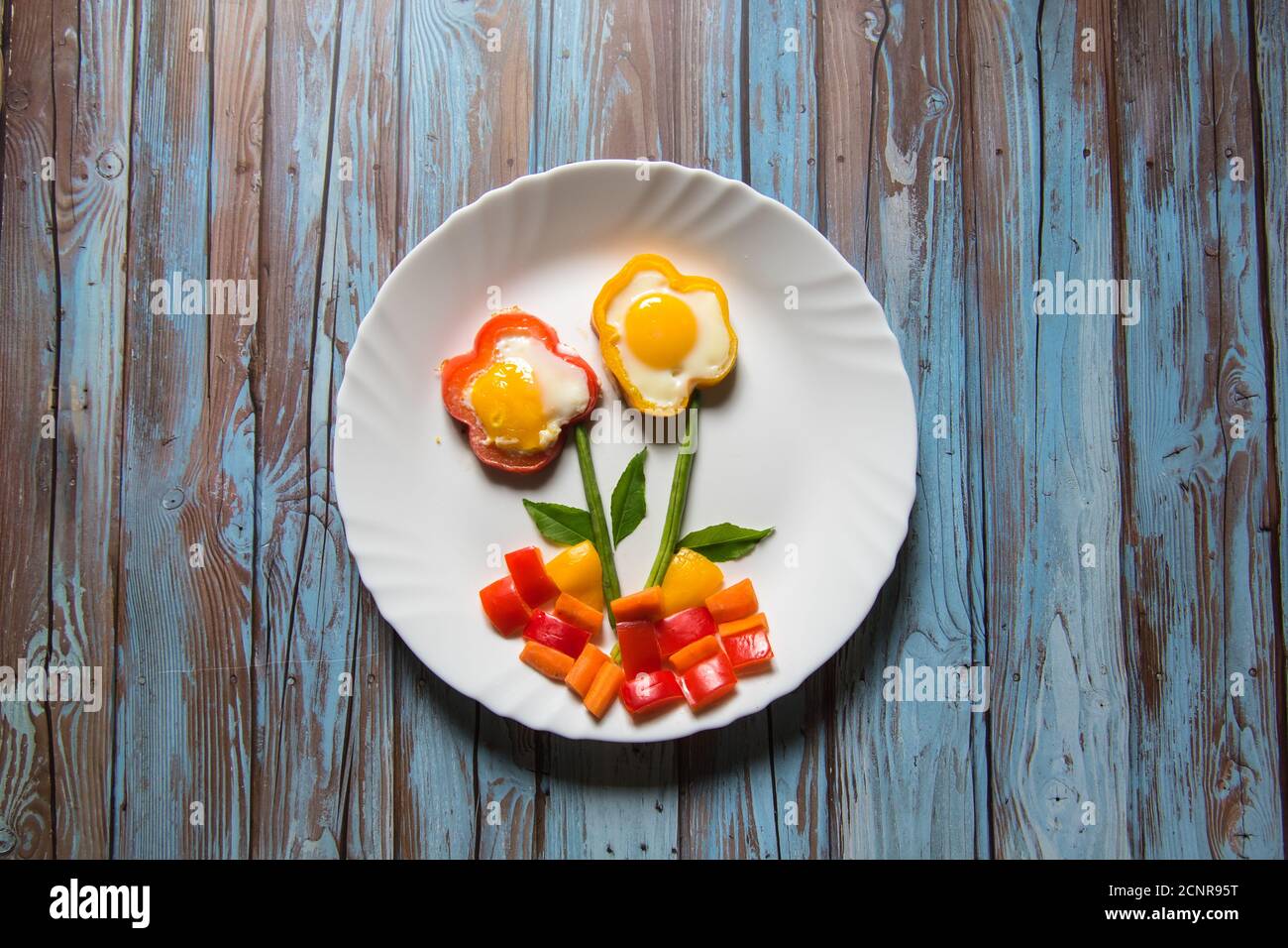 Food ingredients used as flower shaped food art in a plate on a ...