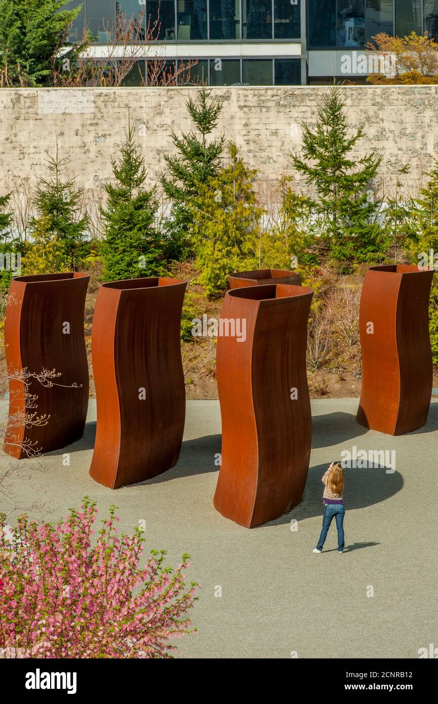 A woman is photographing the Wake, a 2004 weathering steel sculpture by ...