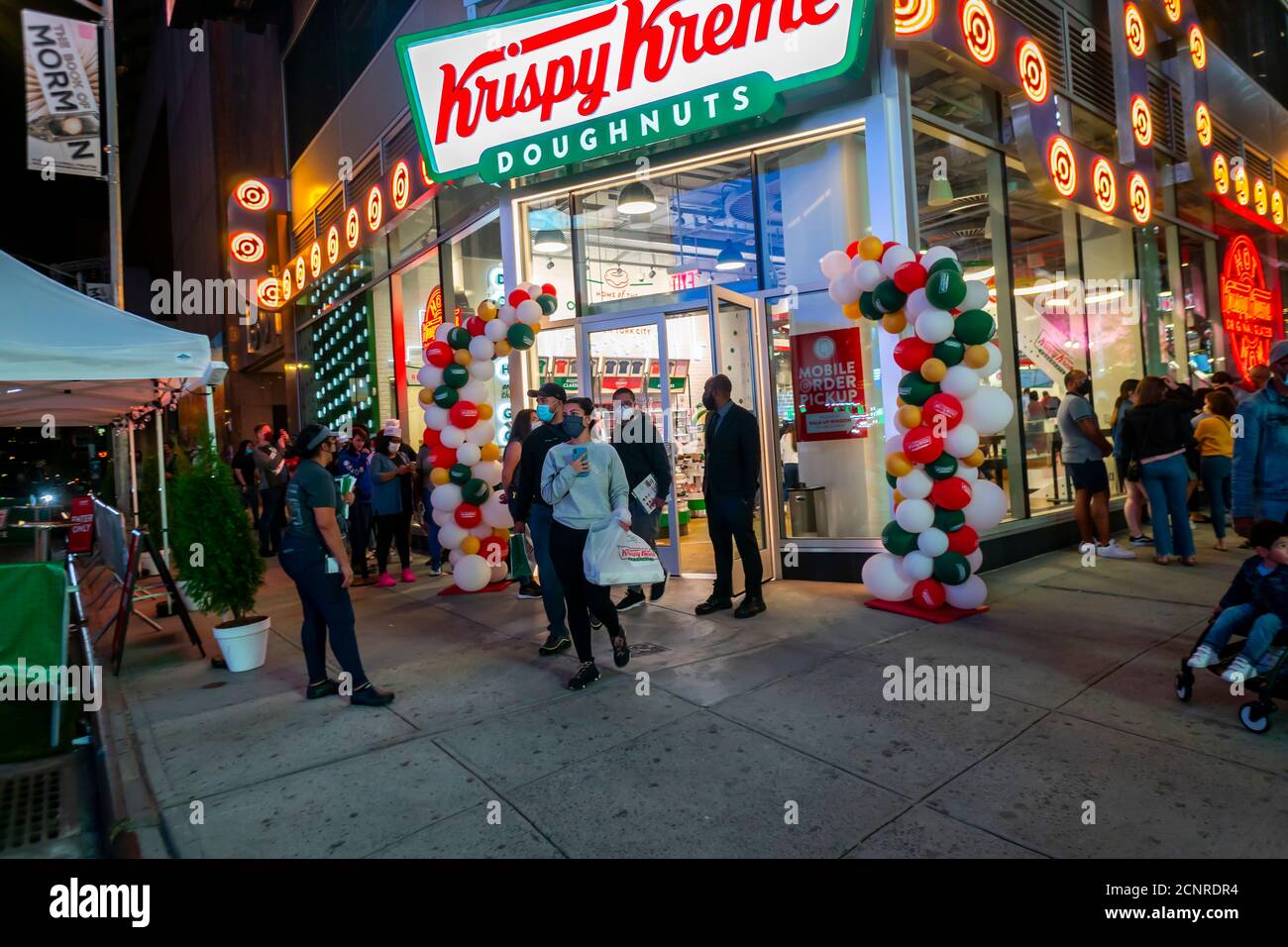 Doughnut lovers flock to the new Krispy Kreme superstore in Times ...
