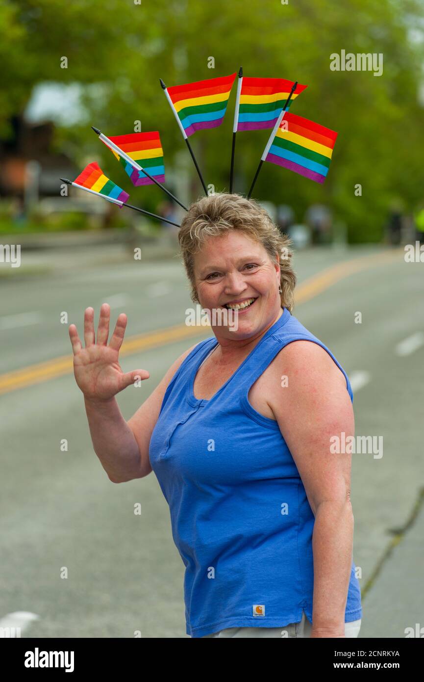 A woman with rainbow flags in her hair during the Seattle Gay Pride ...