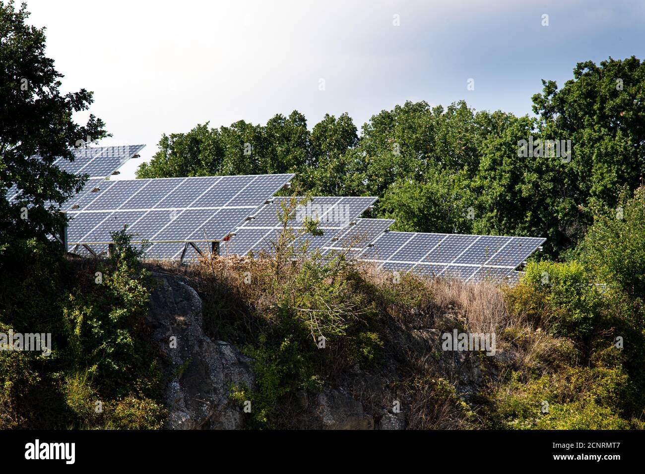 Large group of solar panels on the hill, photovoltaic power green ...