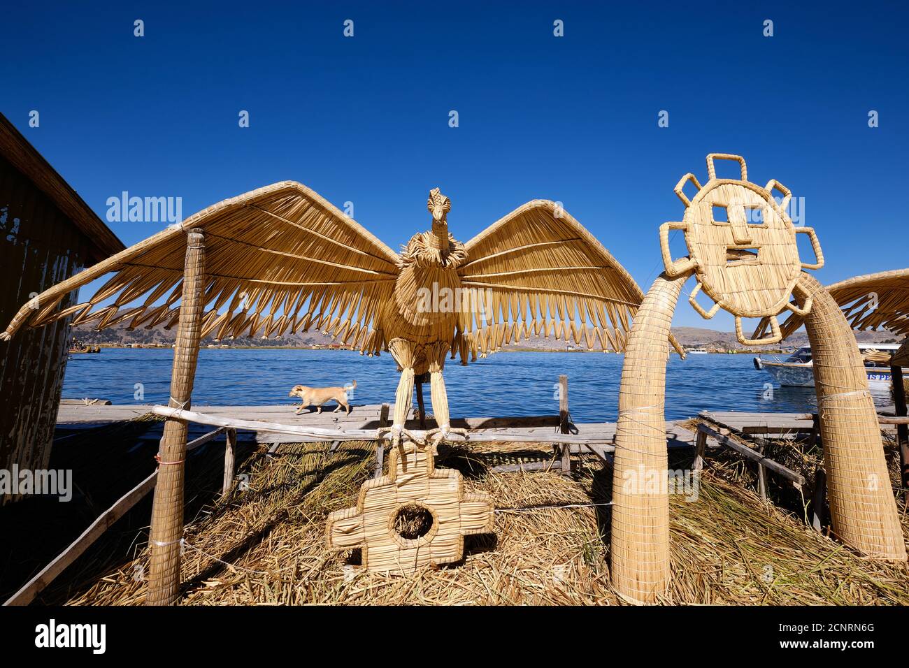 A condor and representation of the sun god made of reeds on the Uros ...